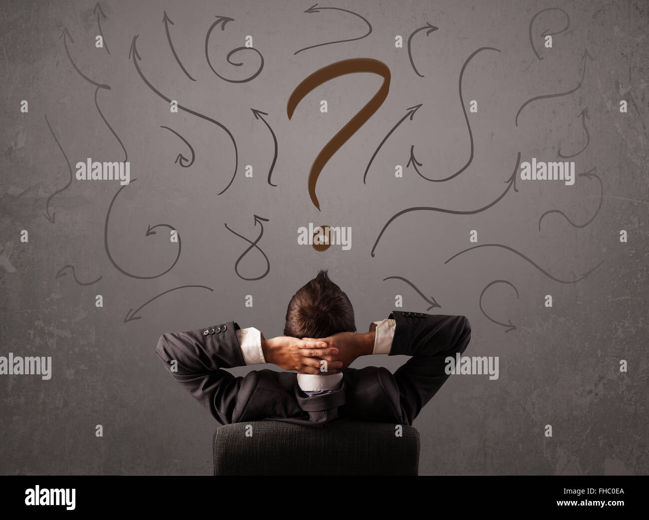 Business man looking at question mark sketch Stock Photo - Alamy
