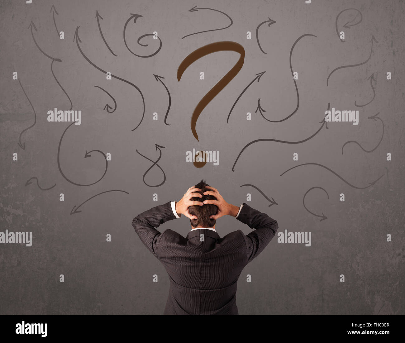 Business man looking at question mark sketch Stock Photo - Alamy