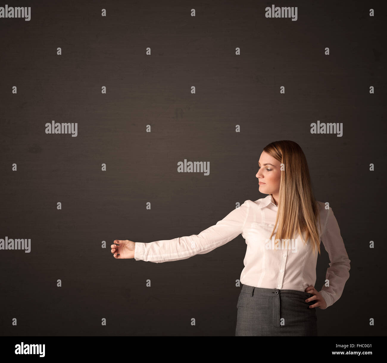 Businesswoman making gestures Stock Photo - Alamy