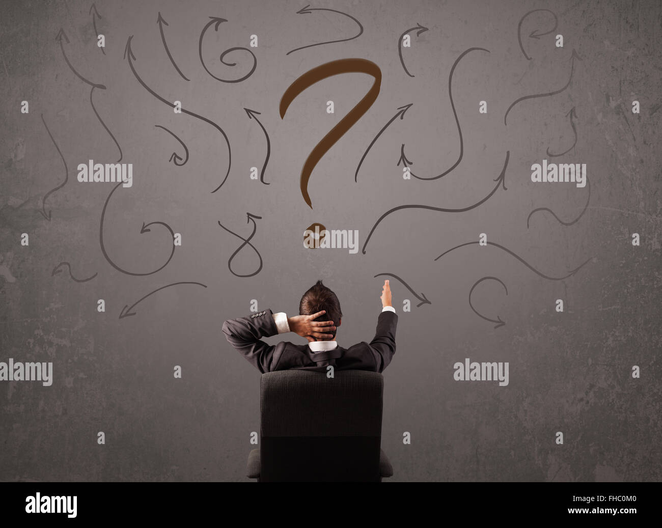 Business man looking at question mark sketch Stock Photo - Alamy