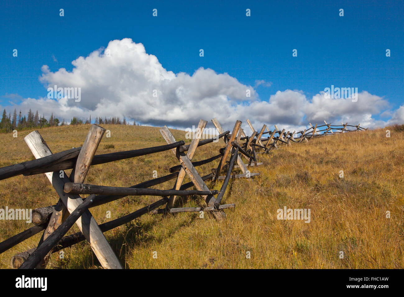 A snow fence near North Creek Gorge in the SAN JUAN MOUNTAINS of ...