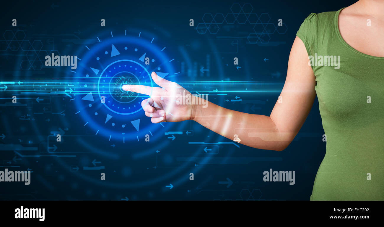 Young tech woman pressing high technology control panel screen concept ...