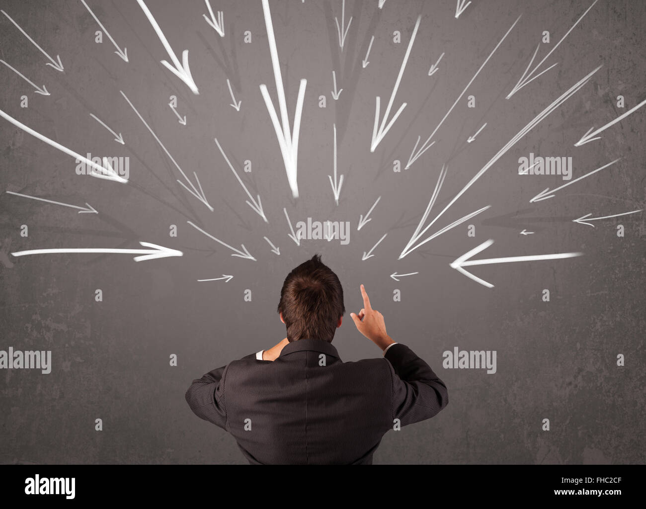 Business man with hand drawn arrows pointing at his head Stock Photo ...