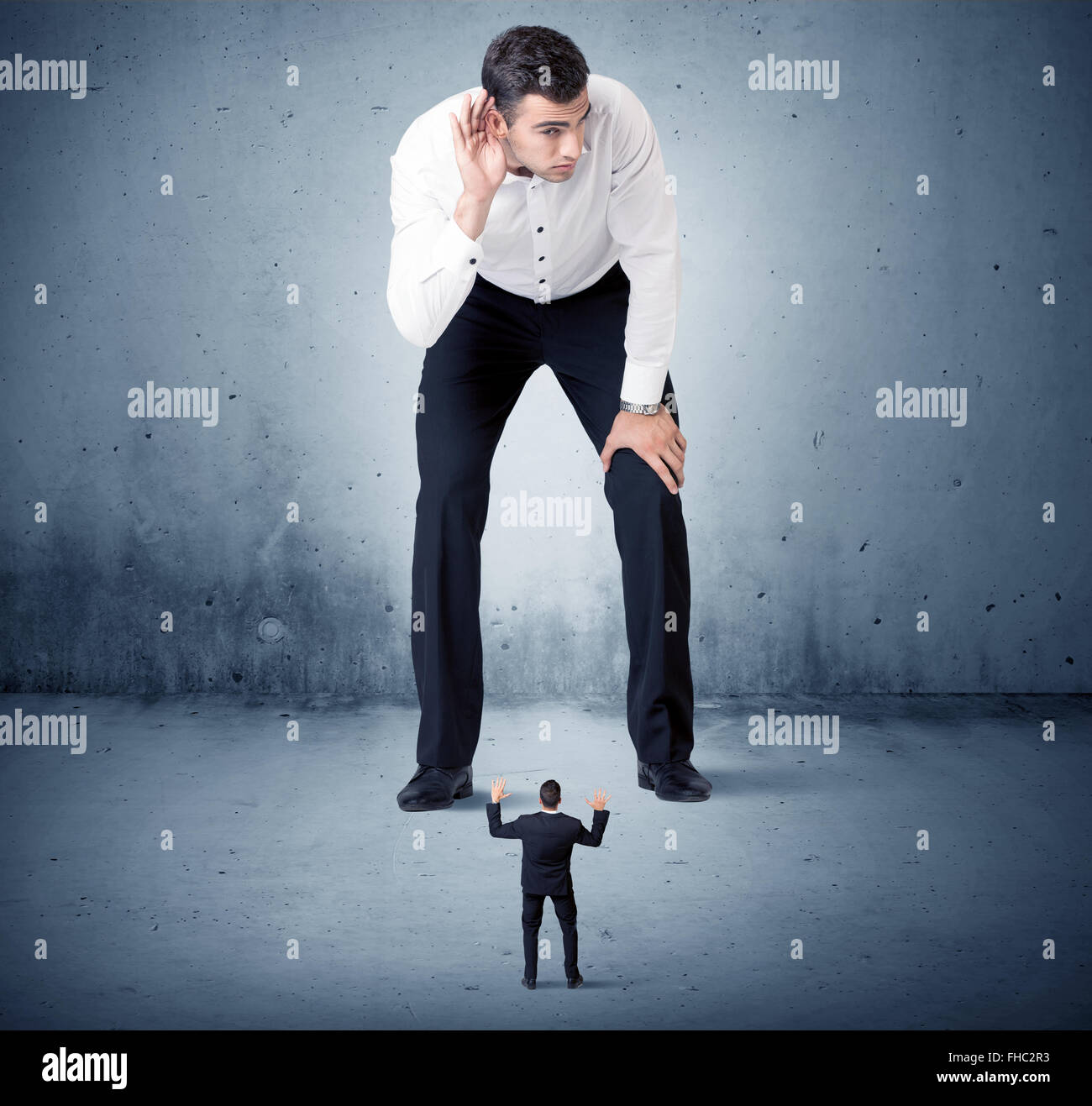 Angry huge business man lokking at small guy Stock Photo - Alamy