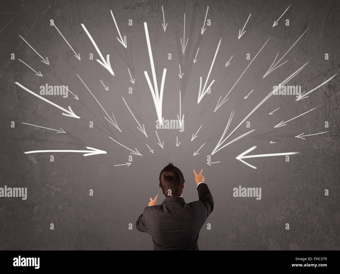 Business man with hand drawn arrows pointing at his head Stock Photo ...