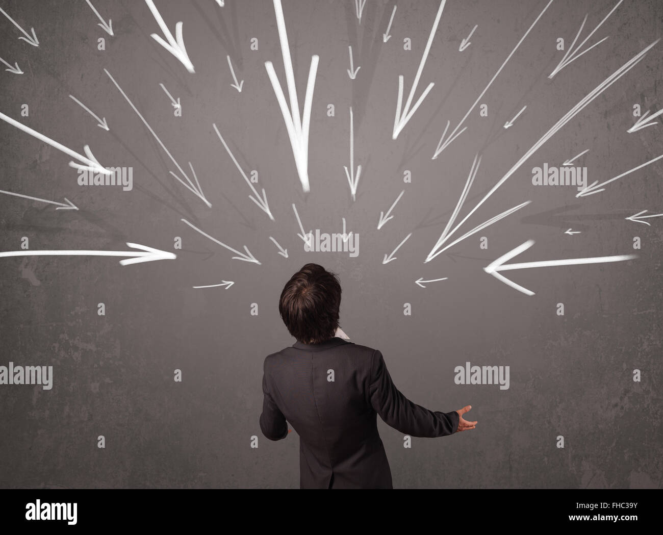 Business man with hand drawn arrows pointing at his head Stock Photo ...