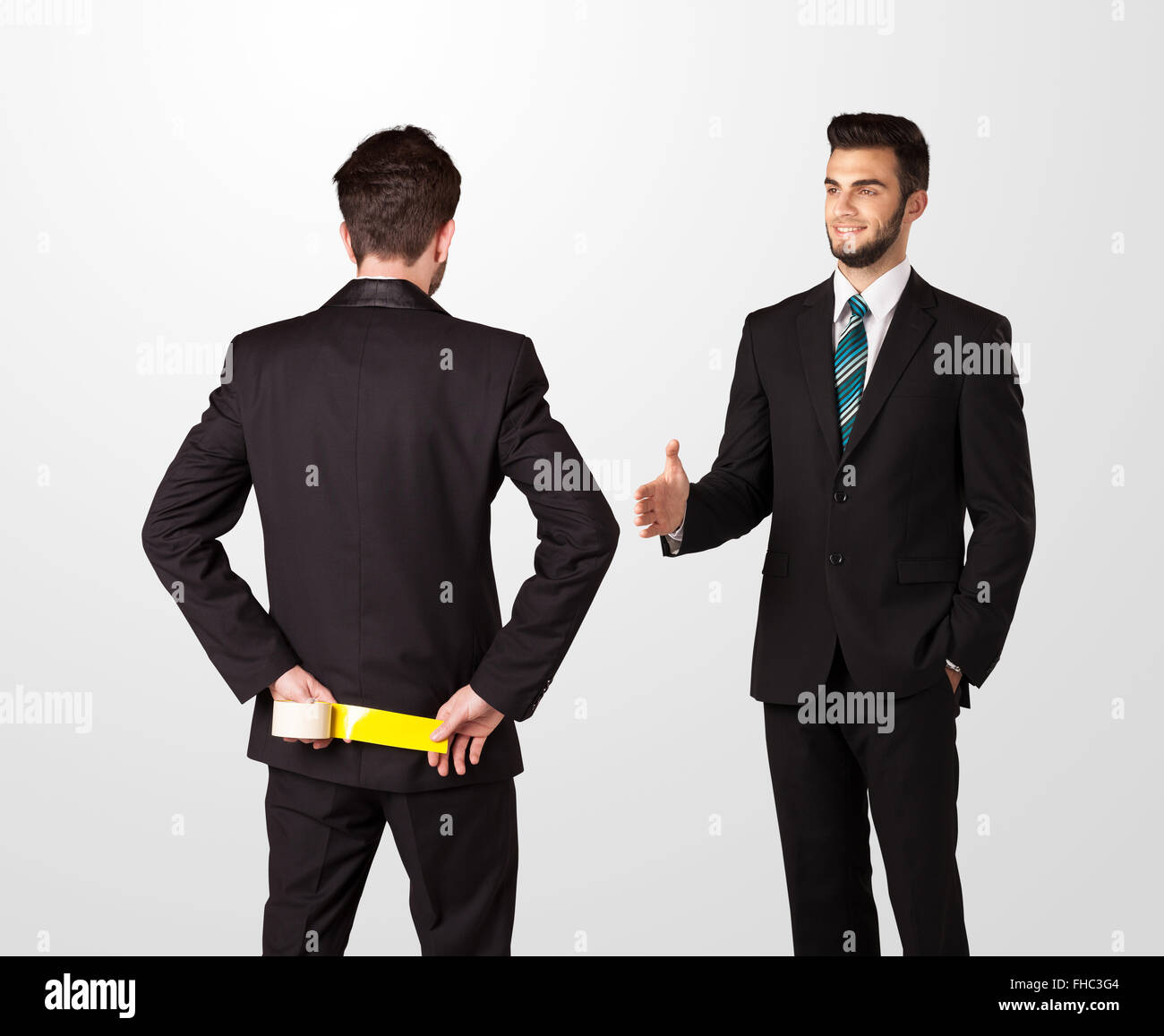 Two businessman shake hands Stock Photo - Alamy