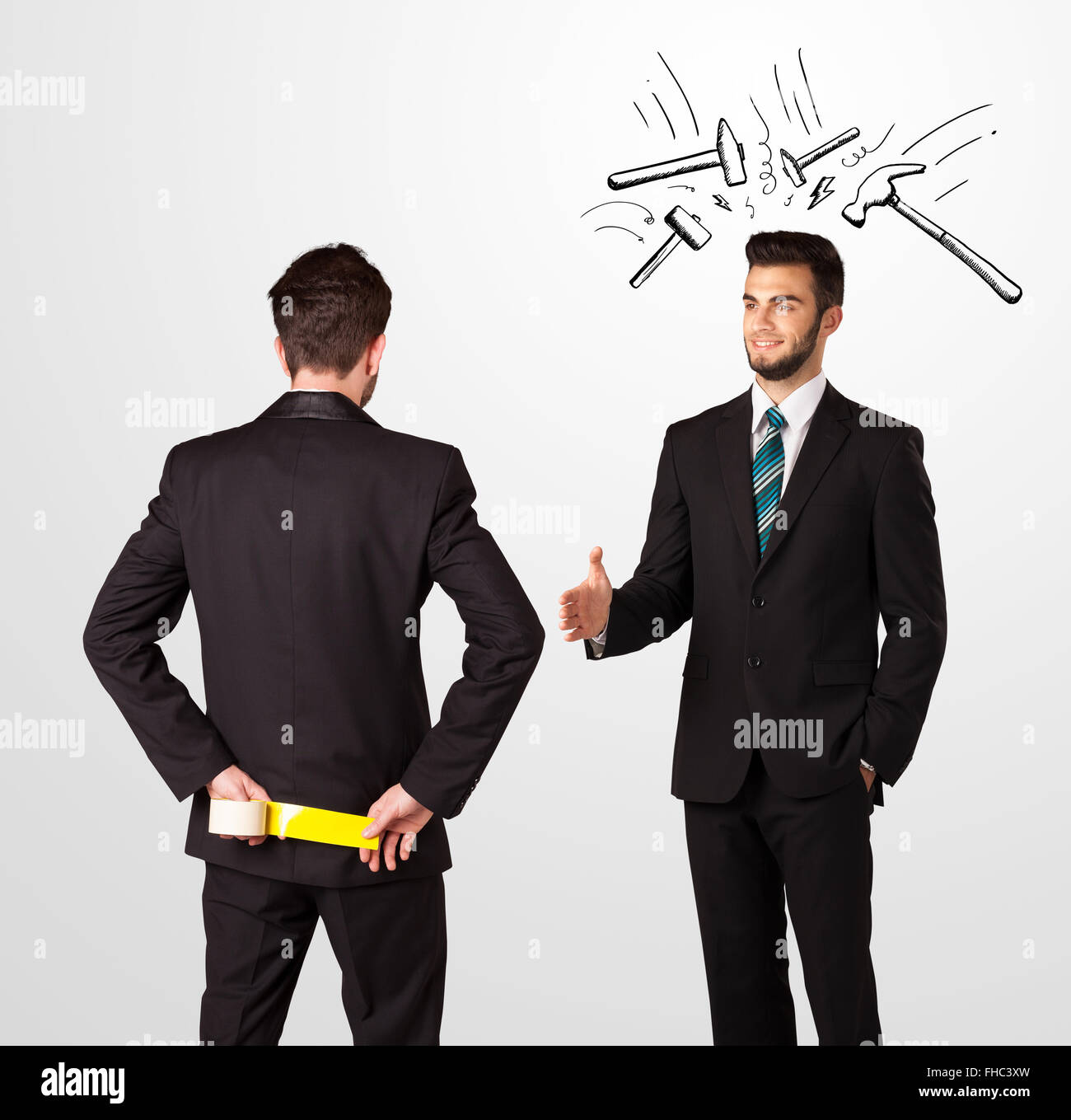 Businessman hiding a weapon Stock Photo - Alamy