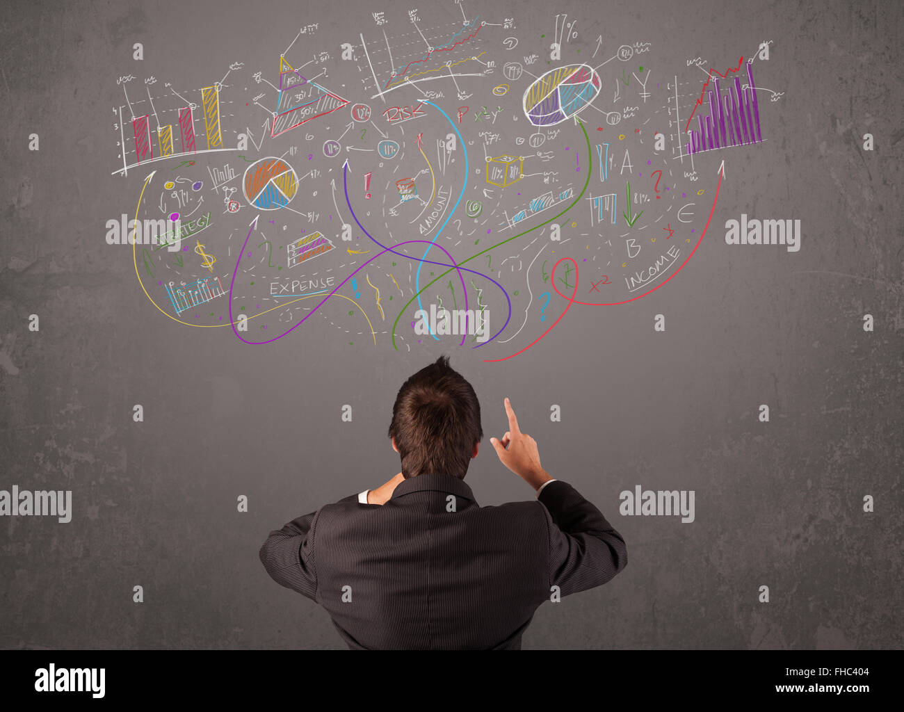 Young business man looking at sketches of graphs and symbols Stock ...