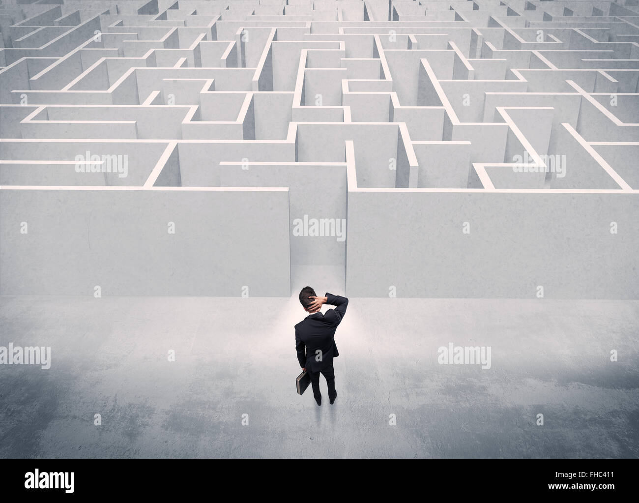 Sales person standing at maze entrance Stock Photo - Alamy