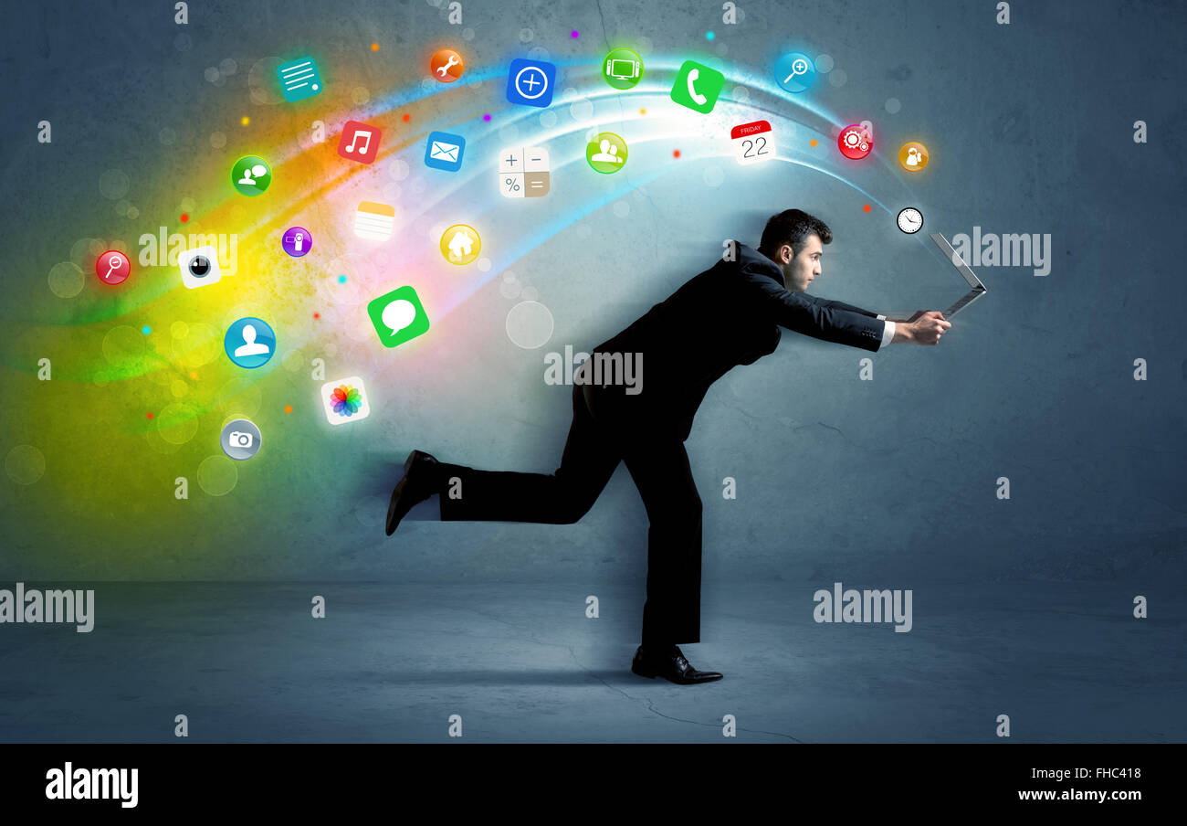 Running businessman with application icons from device Stock Photo - Alamy
