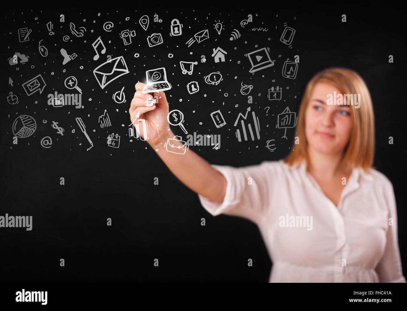 Young woman drawing and sketching icons and symbols Stock Photo - Alamy