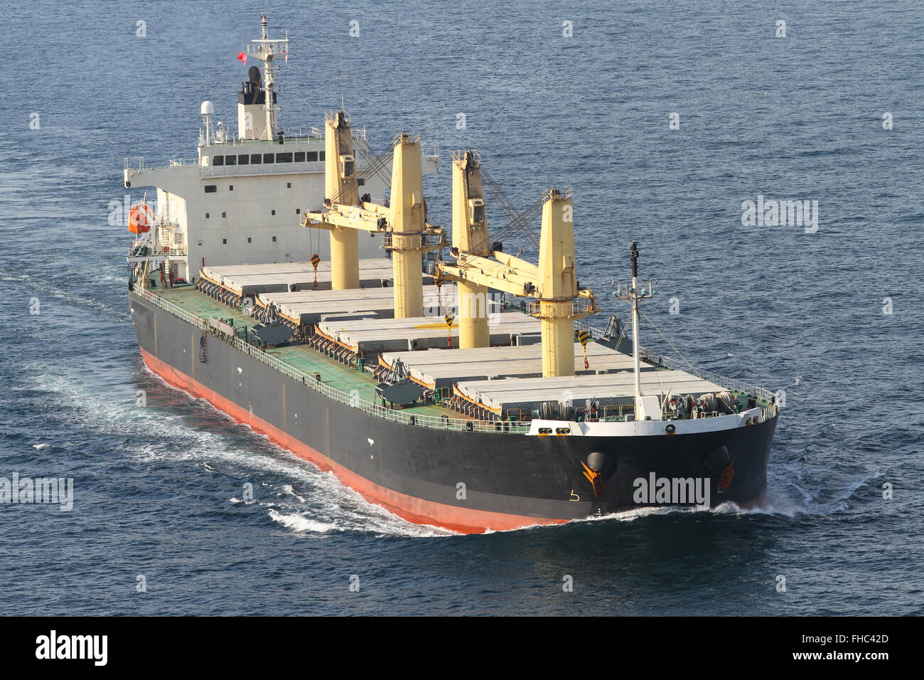 A cargo ship carrying goods between ports Stock Photo - Alamy