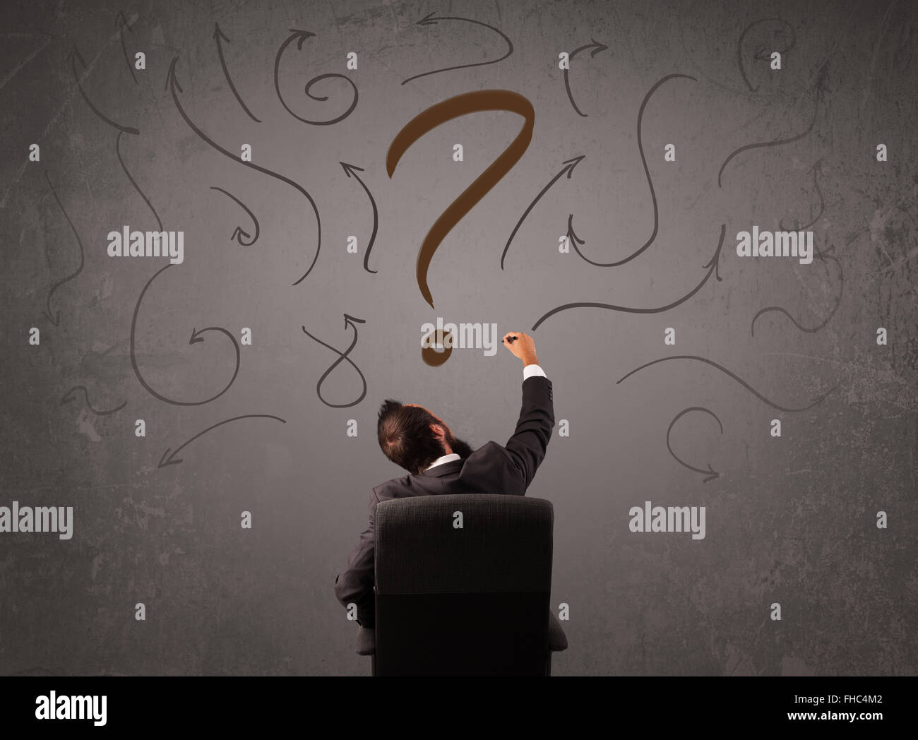 Business man looking at question mark sketch Stock Photo - Alamy