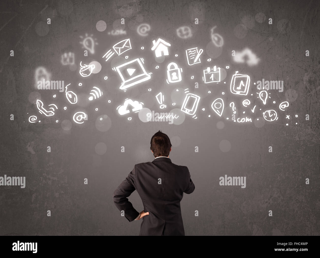 Business man looking at modern icons and symbols Stock Photo - Alamy