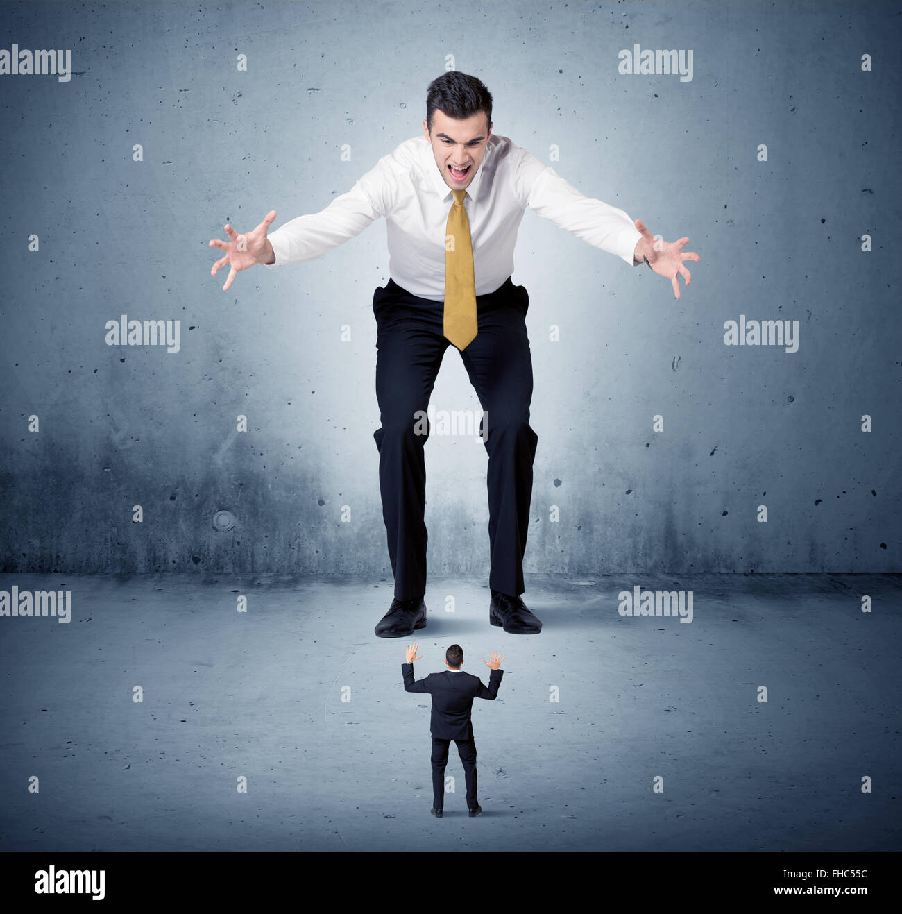 Angry huge business man lokking at small guy Stock Photo - Alamy