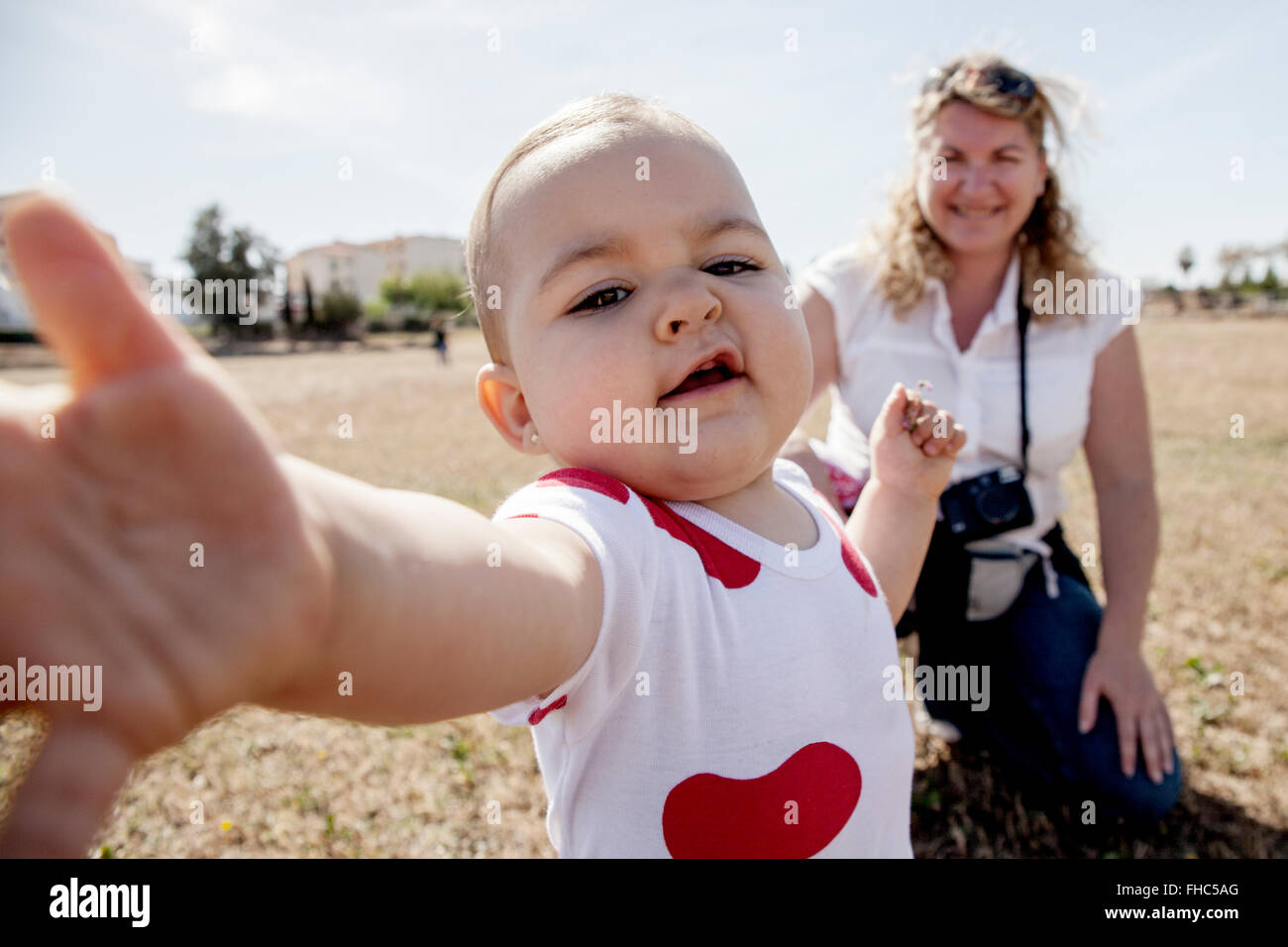 Baby reaching camera hi-res stock photography and images - Alamy