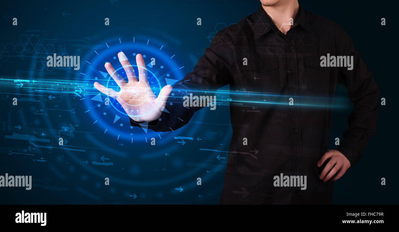 Handsome tech guy pressing high technology control panel screen concept ...