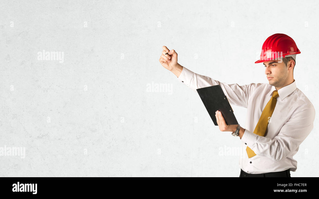 Young architect drawing in empty space Stock Photo - Alamy