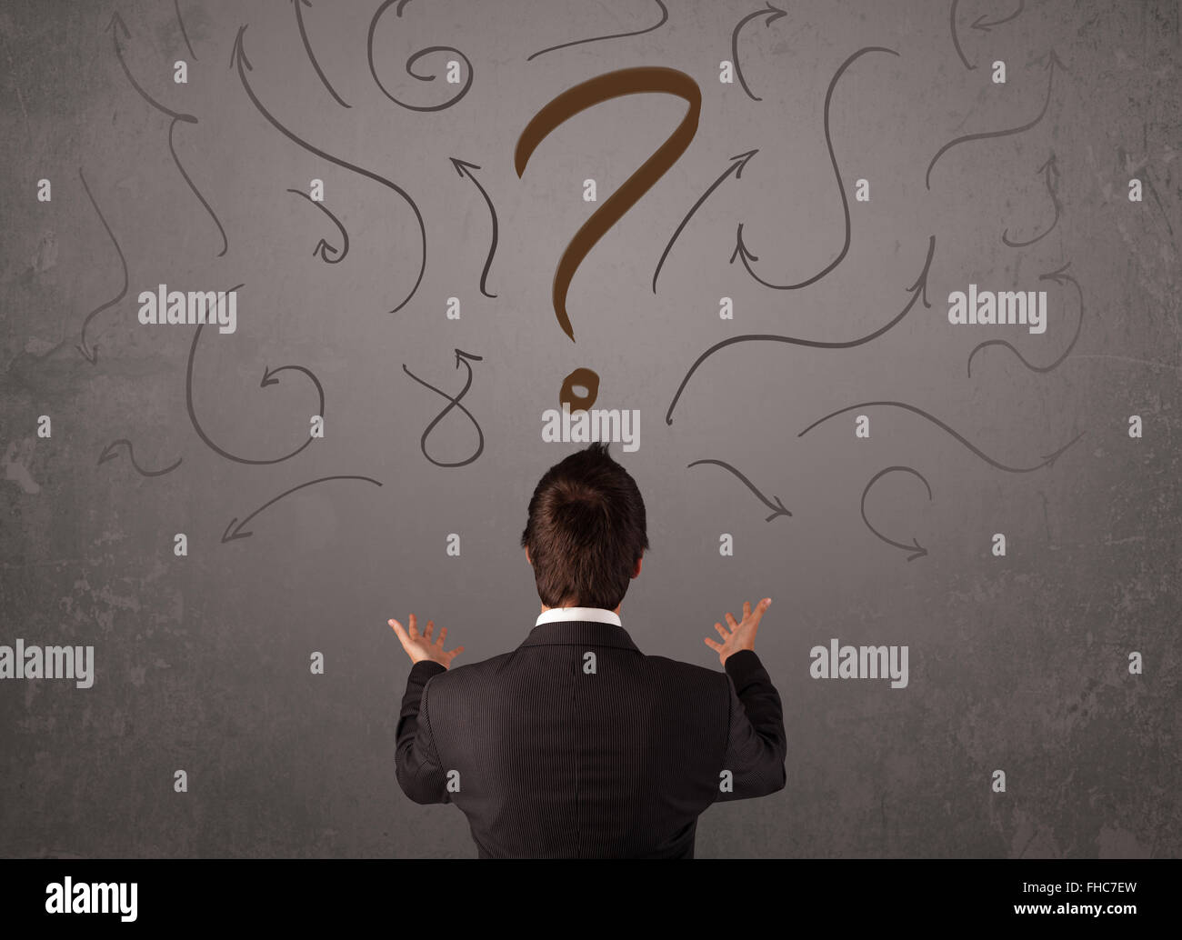 Business man looking at question mark sketch Stock Photo - Alamy