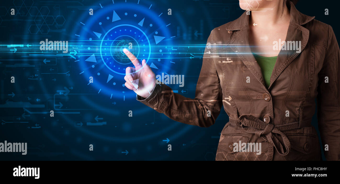 Young tech woman pressing high technology control panel screen concept ...