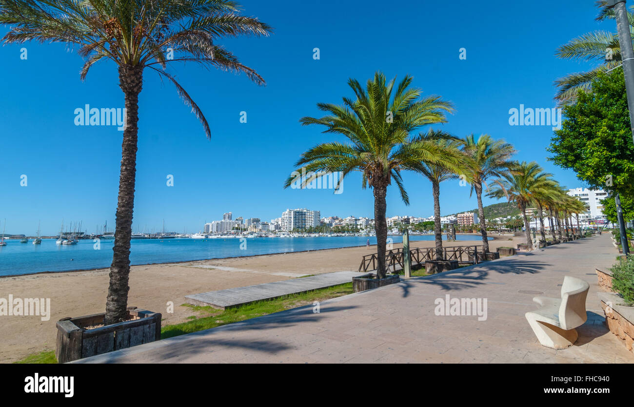 Mid morning sun on the waterfront. Warm sunny day along the beach in ...