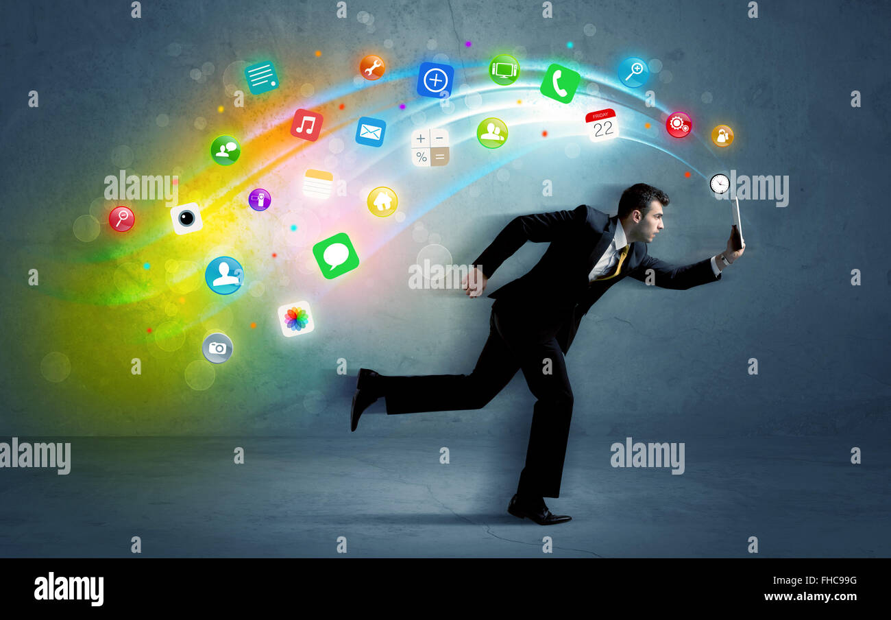 Running businessman with application icons from device Stock Photo - Alamy