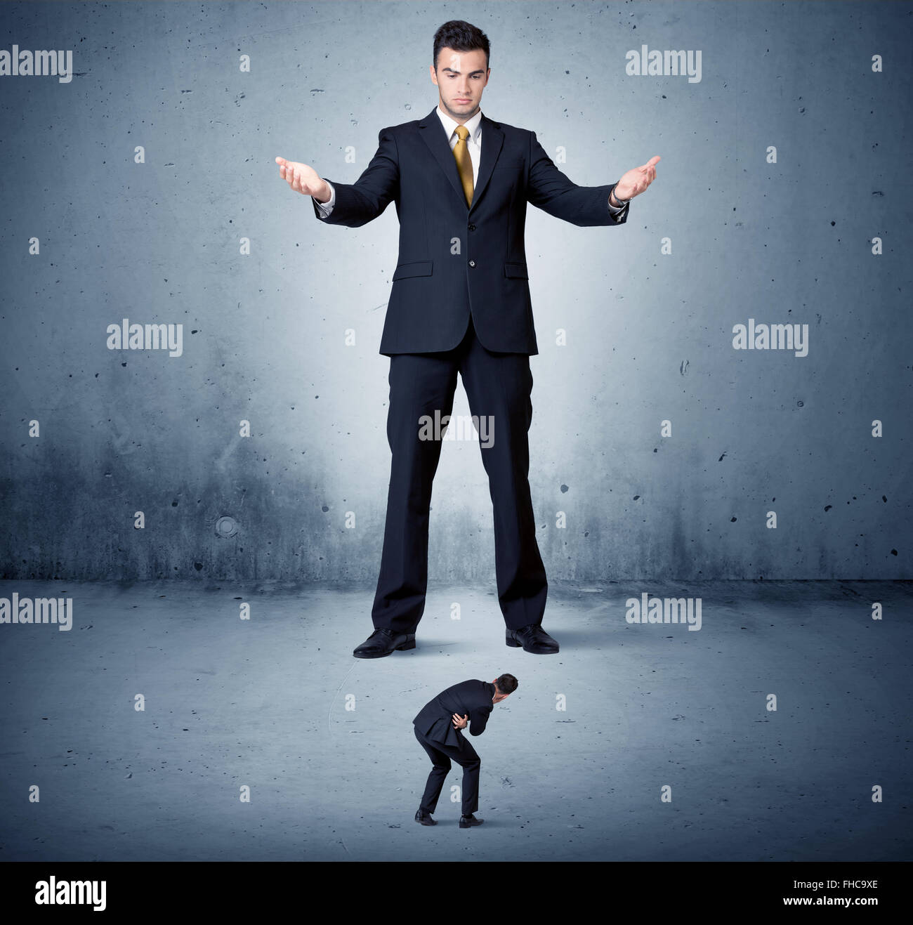 Angry huge business man lokking at small guy Stock Photo - Alamy