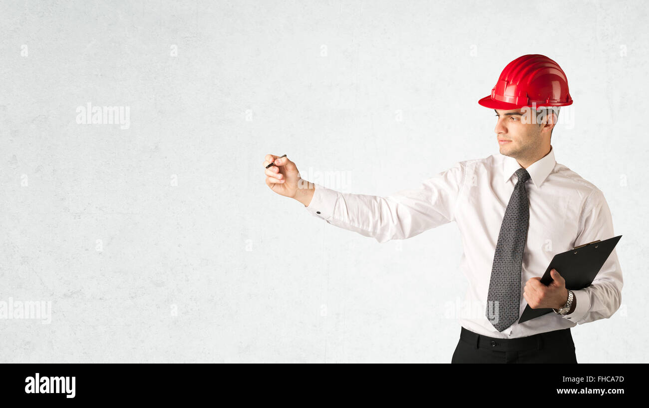 Young architect drawing in empty space Stock Photo - Alamy