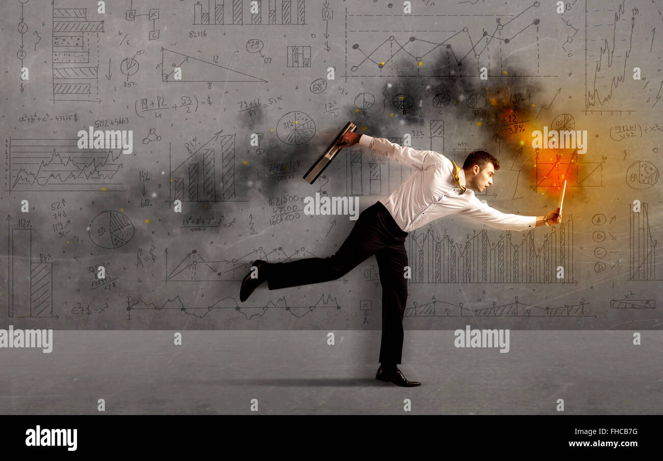 Running business man with fire laptop Stock Photo - Alamy