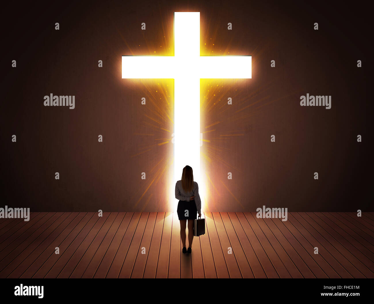 Woman looking at bright cross sign Stock Photo - Alamy