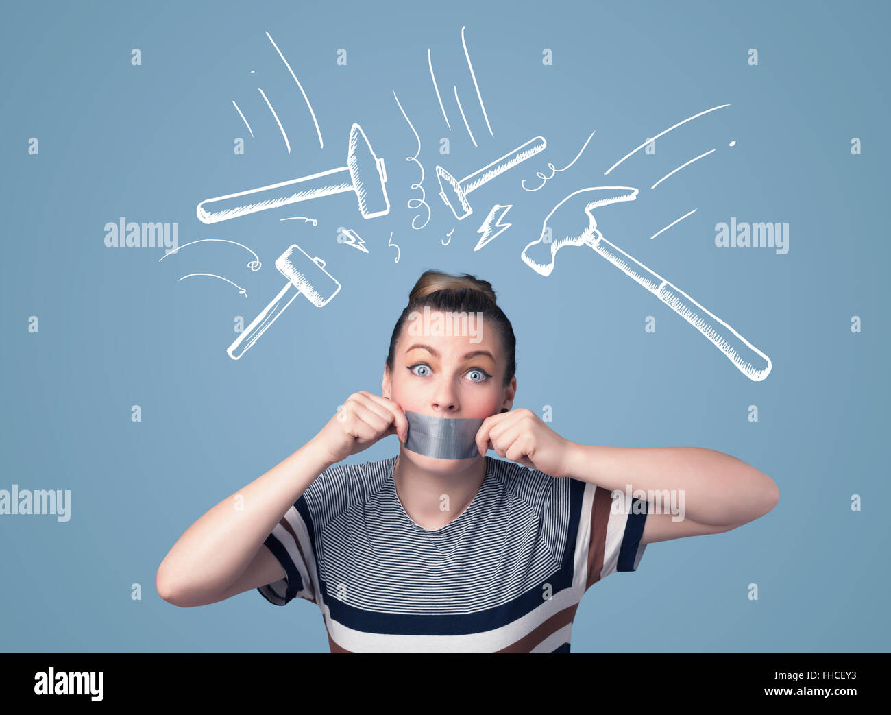 Young woman with glued mouth and hammer marks Stock Photo - Alamy