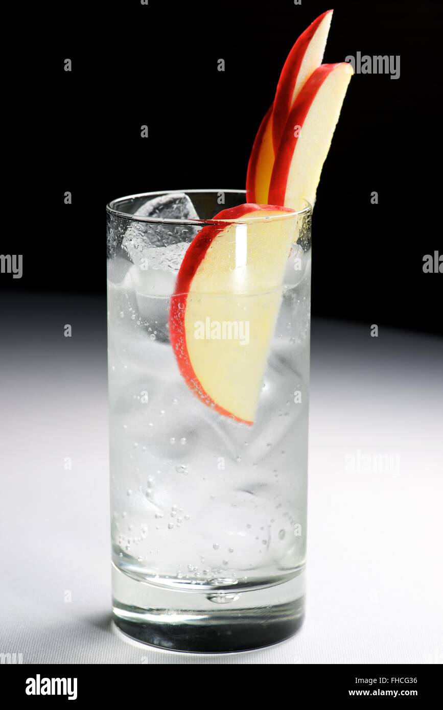 Apple gin tonic served in glass Stock Photo - Alamy
