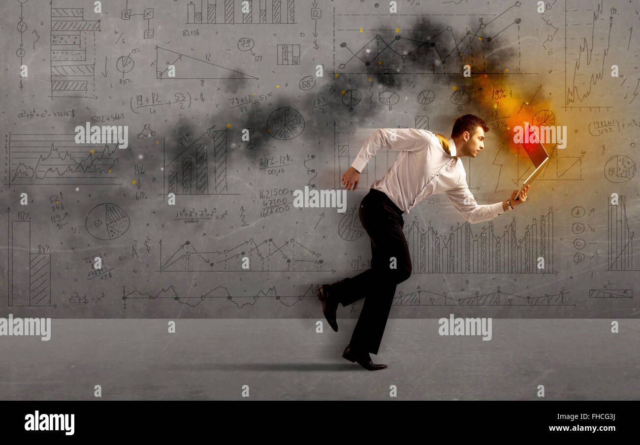 Running business man with fire laptop Stock Photo - Alamy