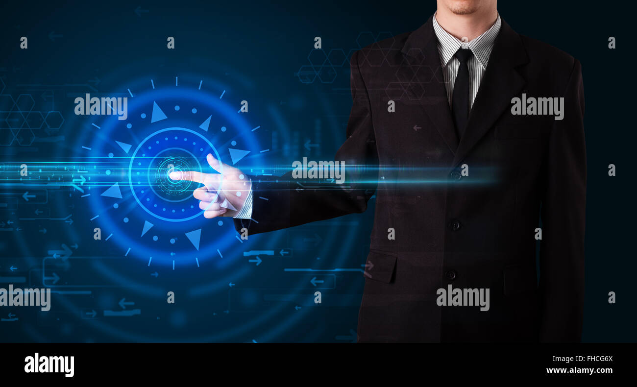 Handsome tech guy pressing high technology control panel screen concept ...