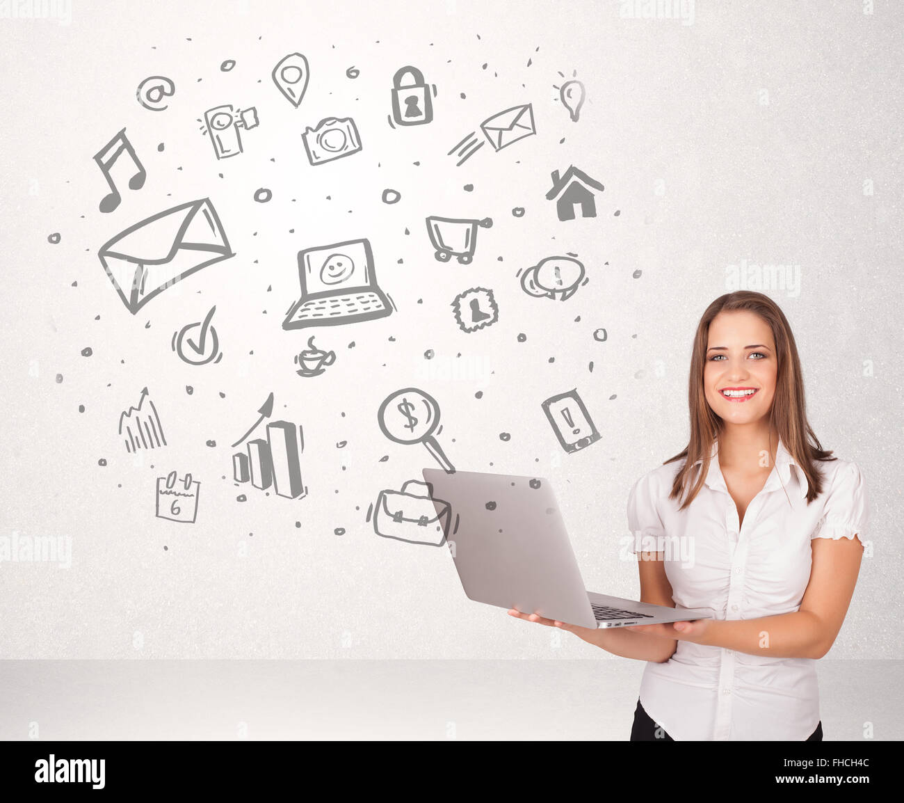 Young business woman presenting hand drawn media icons Stock Photo - Alamy