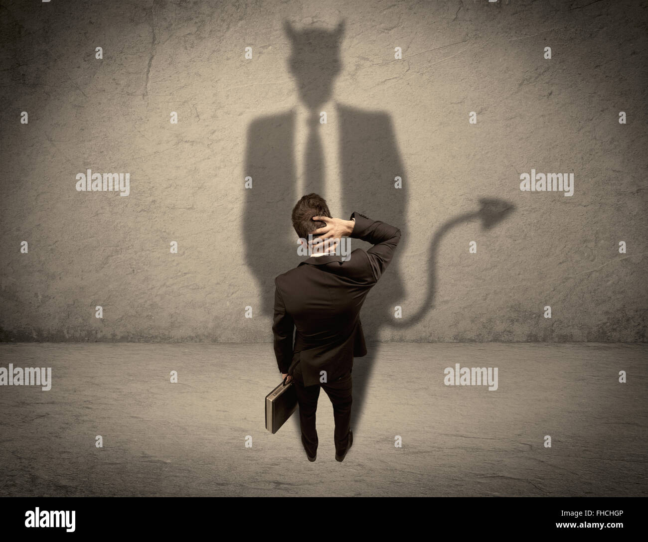 Salesman facing his own devil shadow Stock Photo - Alamy