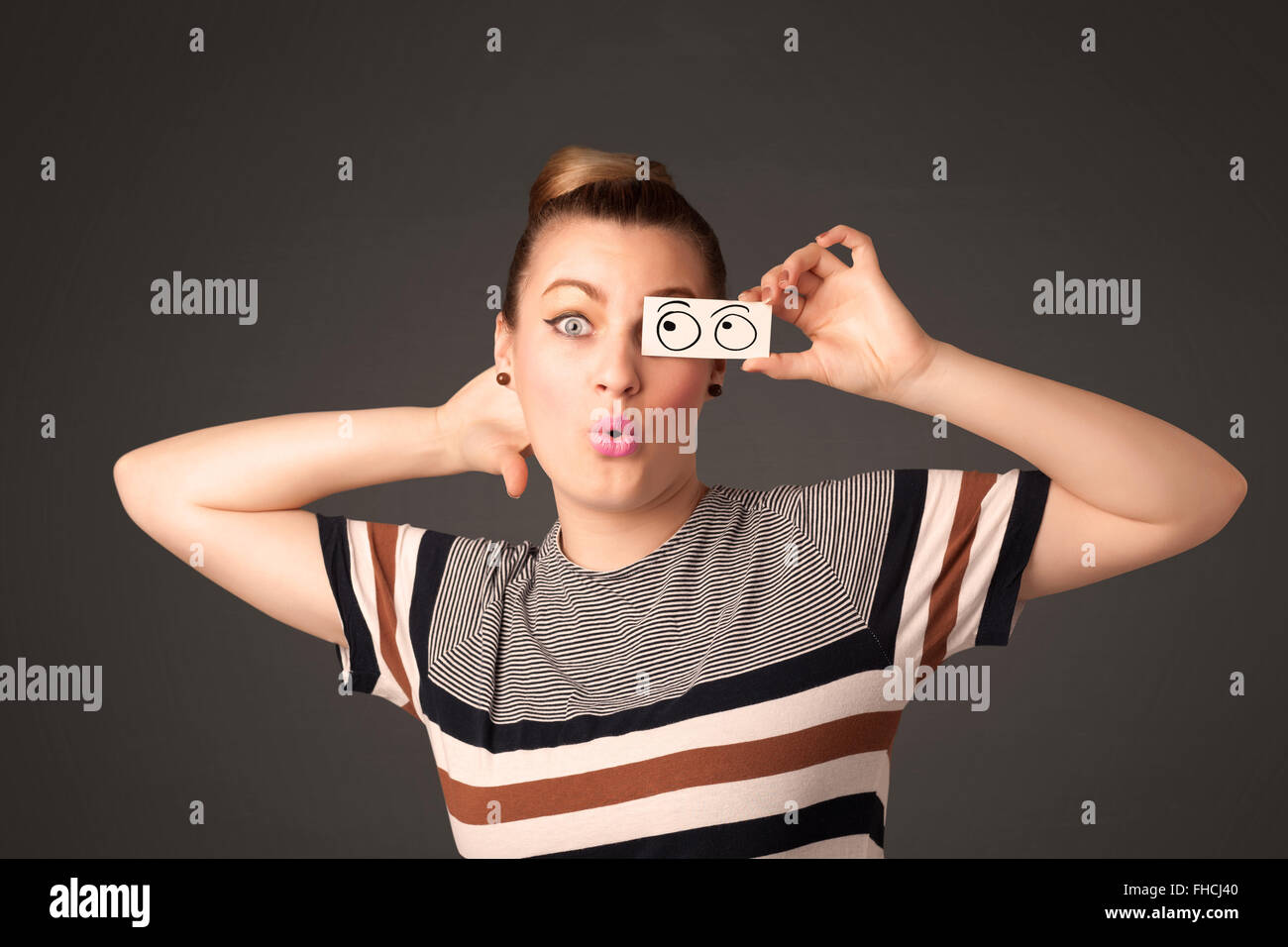 Young silly girl looking with hand drawn eye balls on paper Stock Photo ...