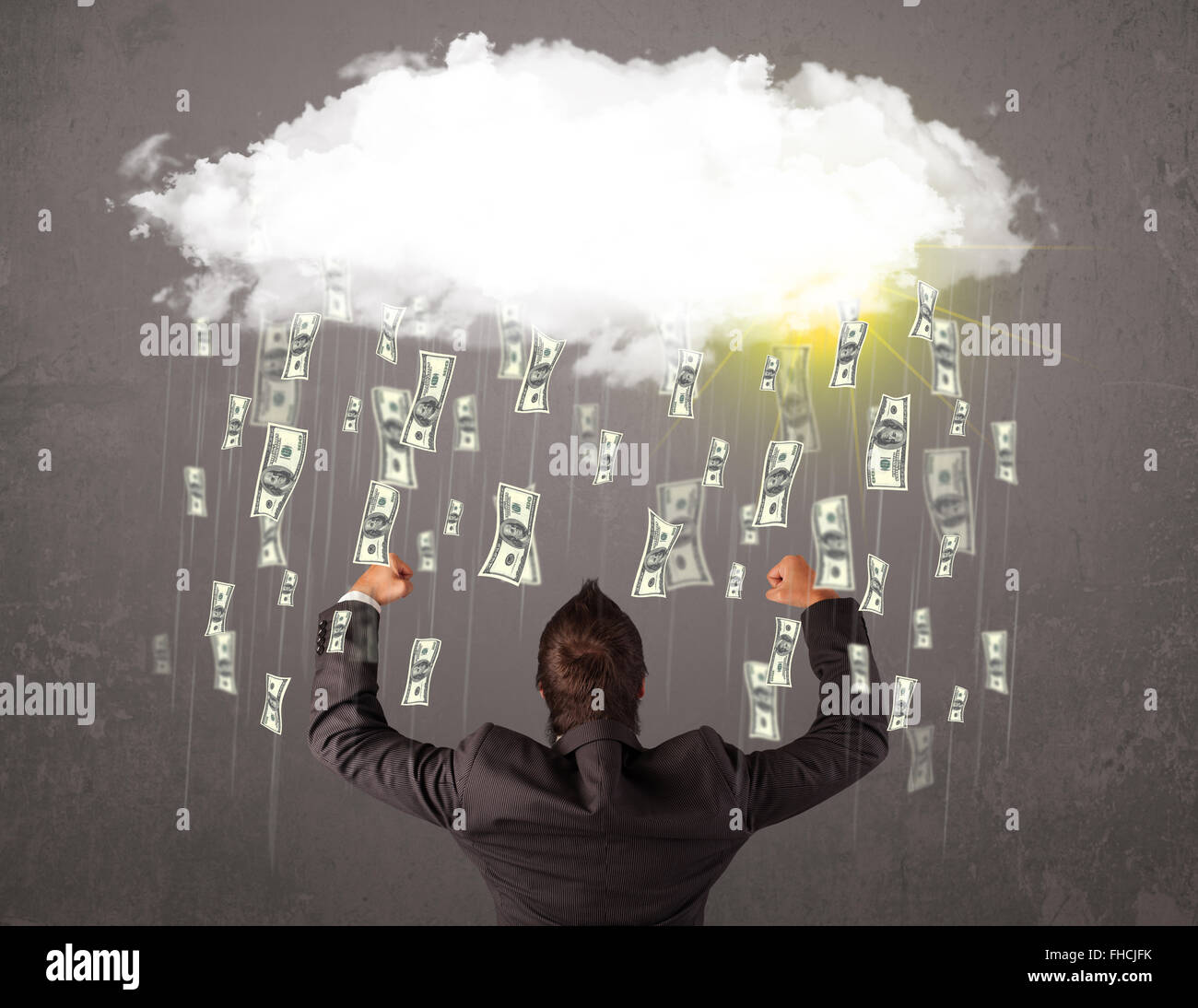 Business man in suit looking at cloud with falling money Stock Photo ...