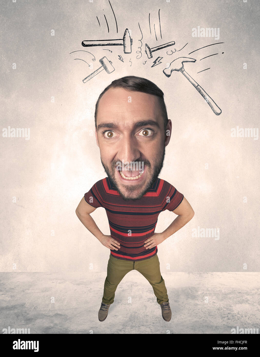 Big head person with drawn hammers Stock Photo - Alamy