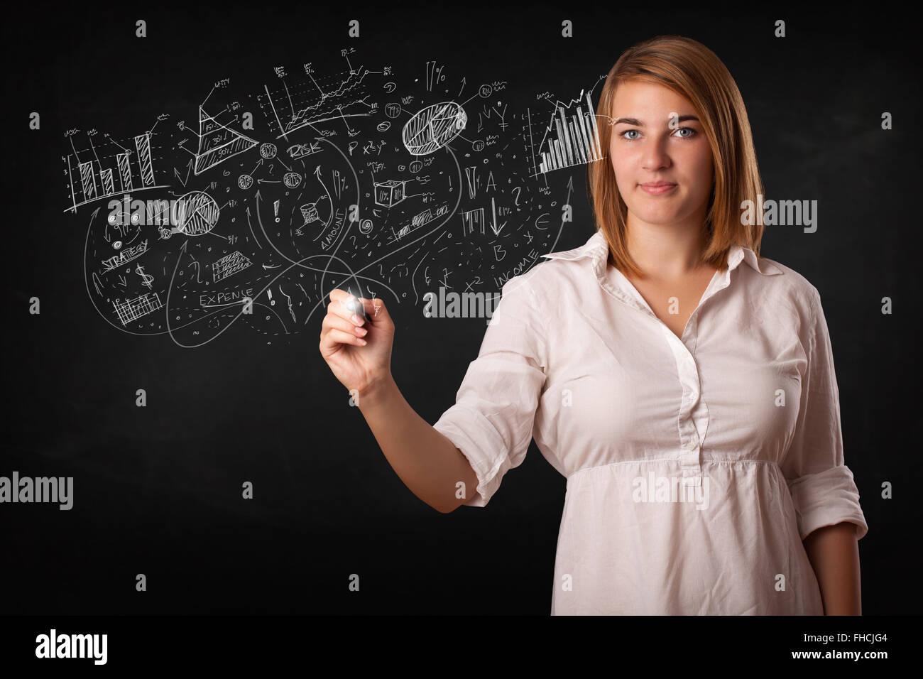 Pretty girl sketching graphs and diagrams on wall Stock Photo - Alamy