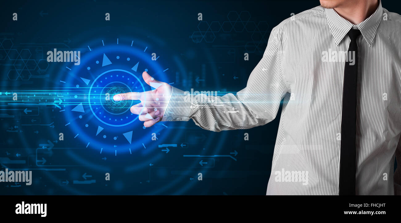 Handsome tech guy pressing high technology control panel screen concept ...