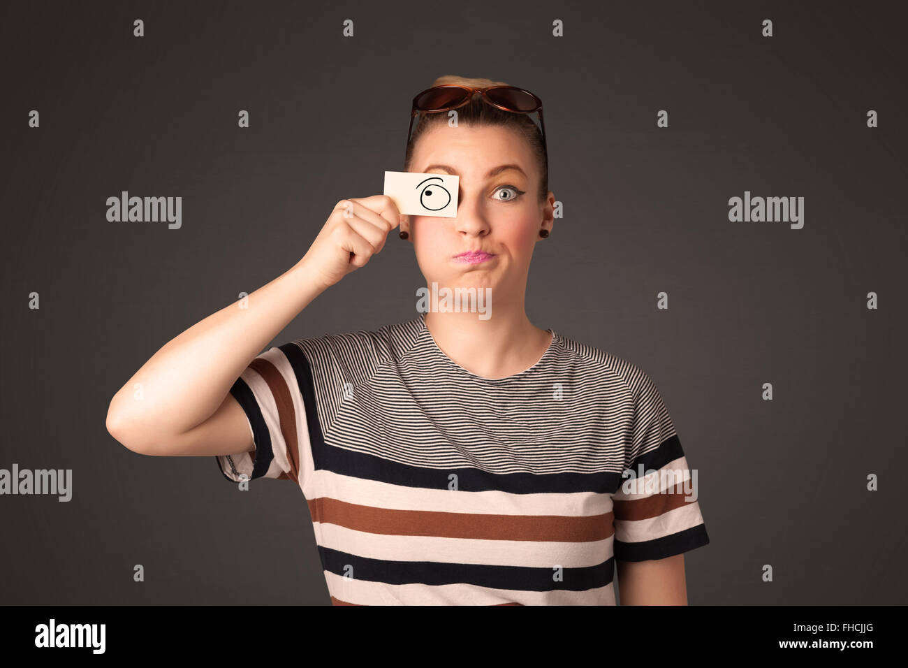 Young silly girl looking with hand drawn eye balls on paper Stock Photo ...
