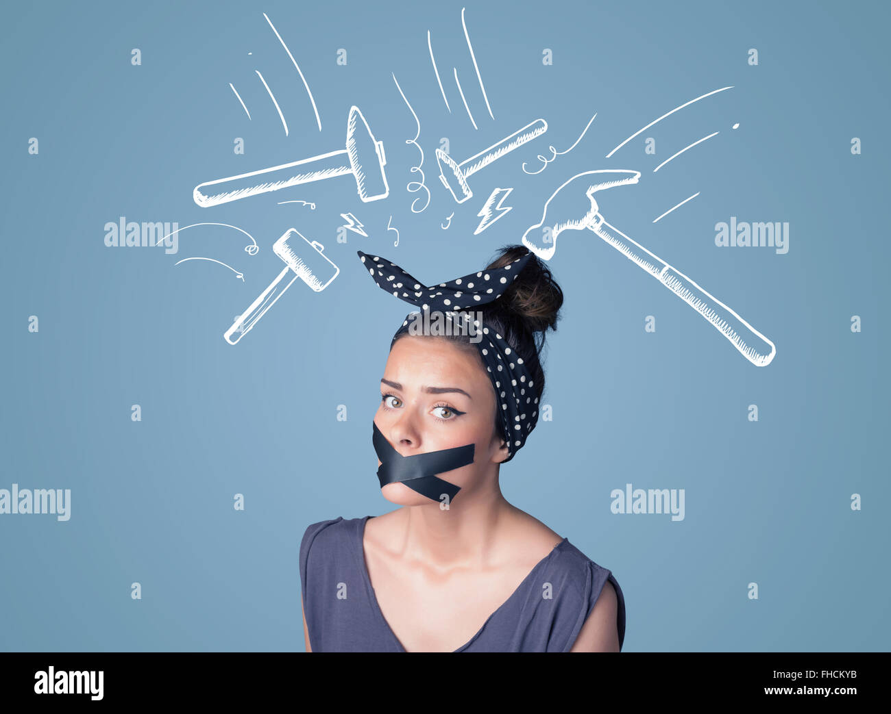 Young woman with glued mouth and hammer marks Stock Photo - Alamy