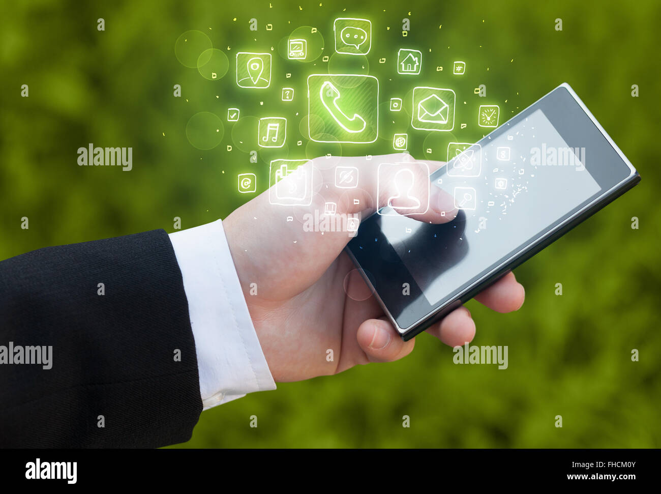 Hand holding smartphone with mobile app icons Stock Photo - Alamy