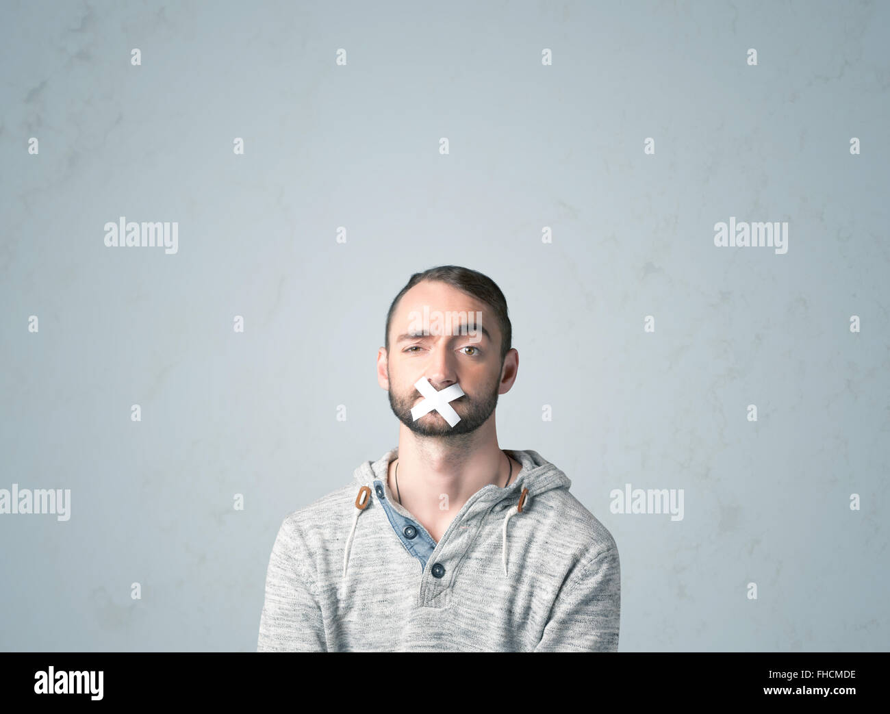 Young man with glued mouth Stock Photo - Alamy