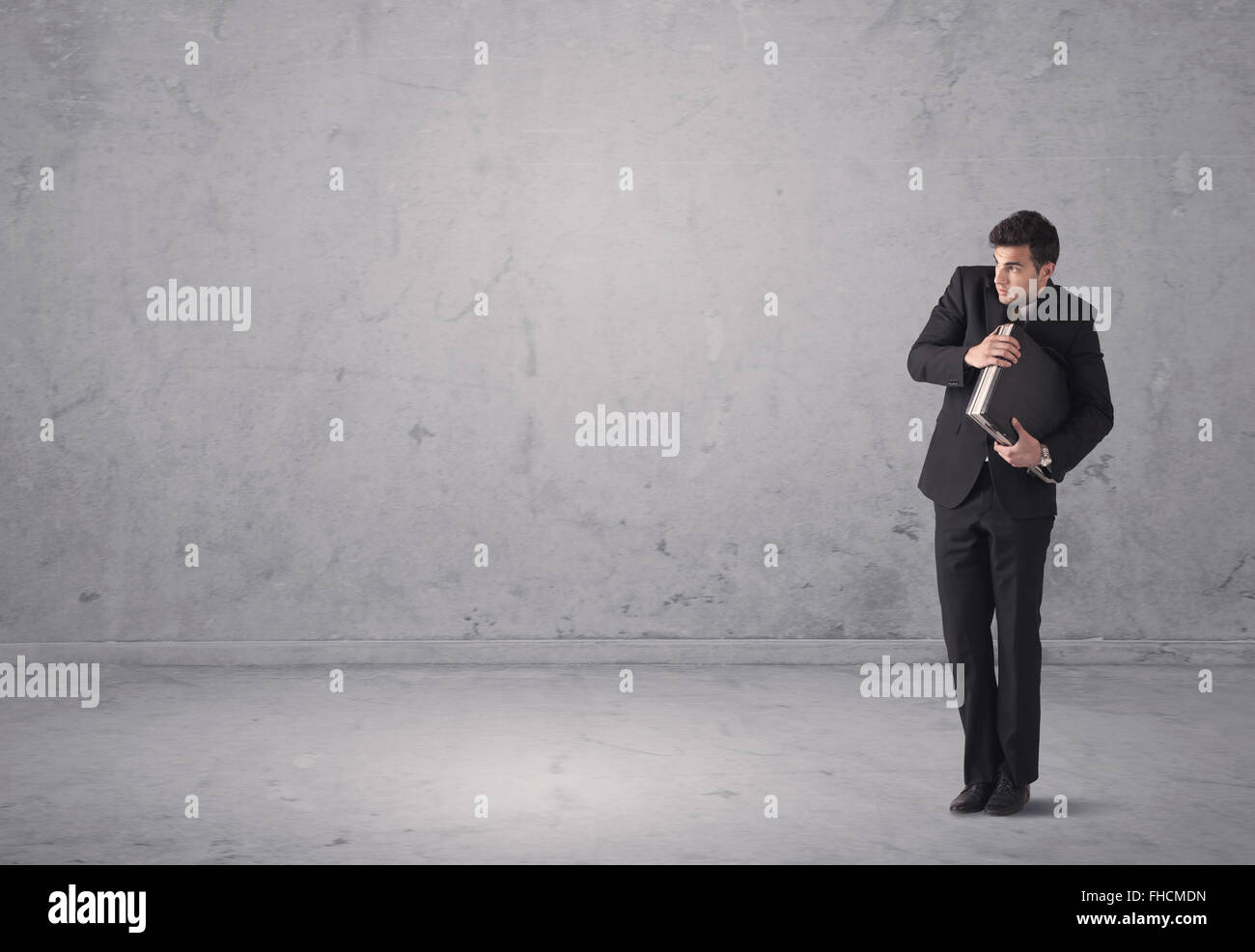 Young businessman standing confused Stock Photo - Alamy