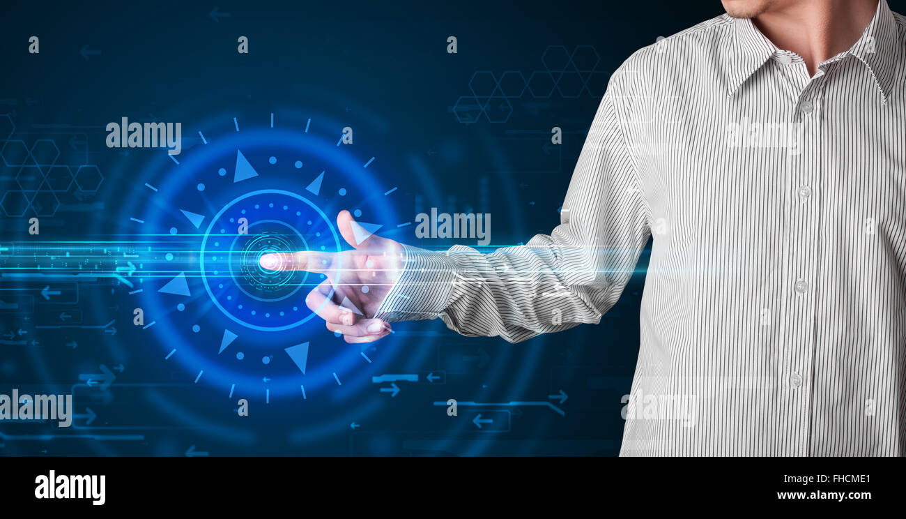Handsome tech guy pressing high technology control panel screen concept ...