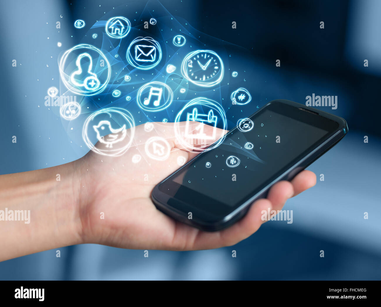 Hand holding smartphone with mobile app choices Stock Photo - Alamy