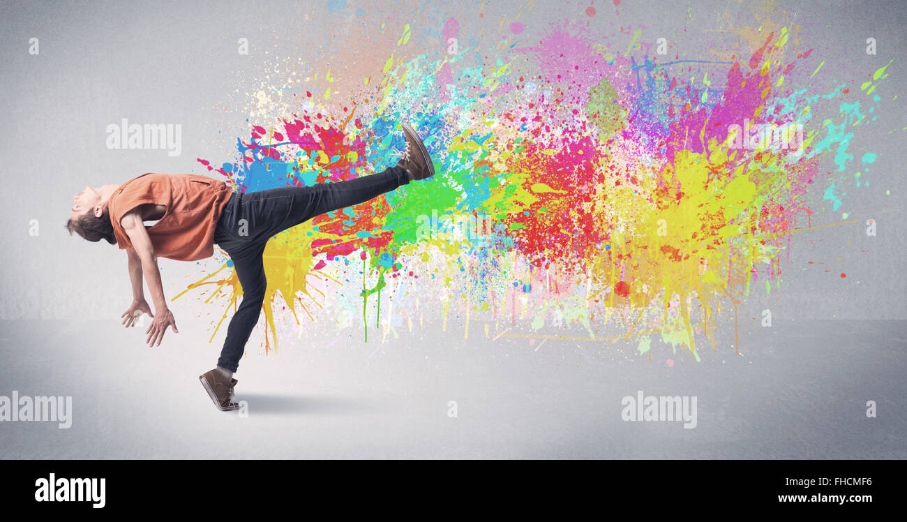 Young colorful street dancer with paint splash Stock Photo - Alamy